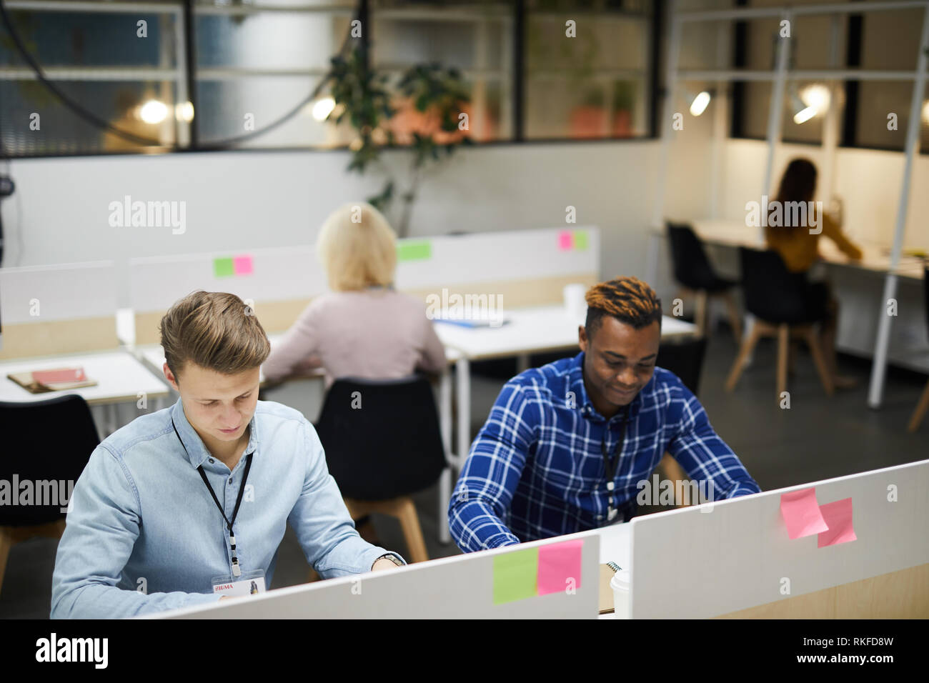 Busy young men at work Stock Photo - Alamy
