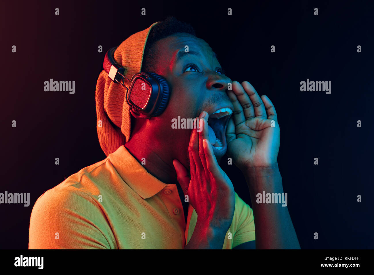 The Young Handsome Happy Hipster Man Listening Music With Headphones At