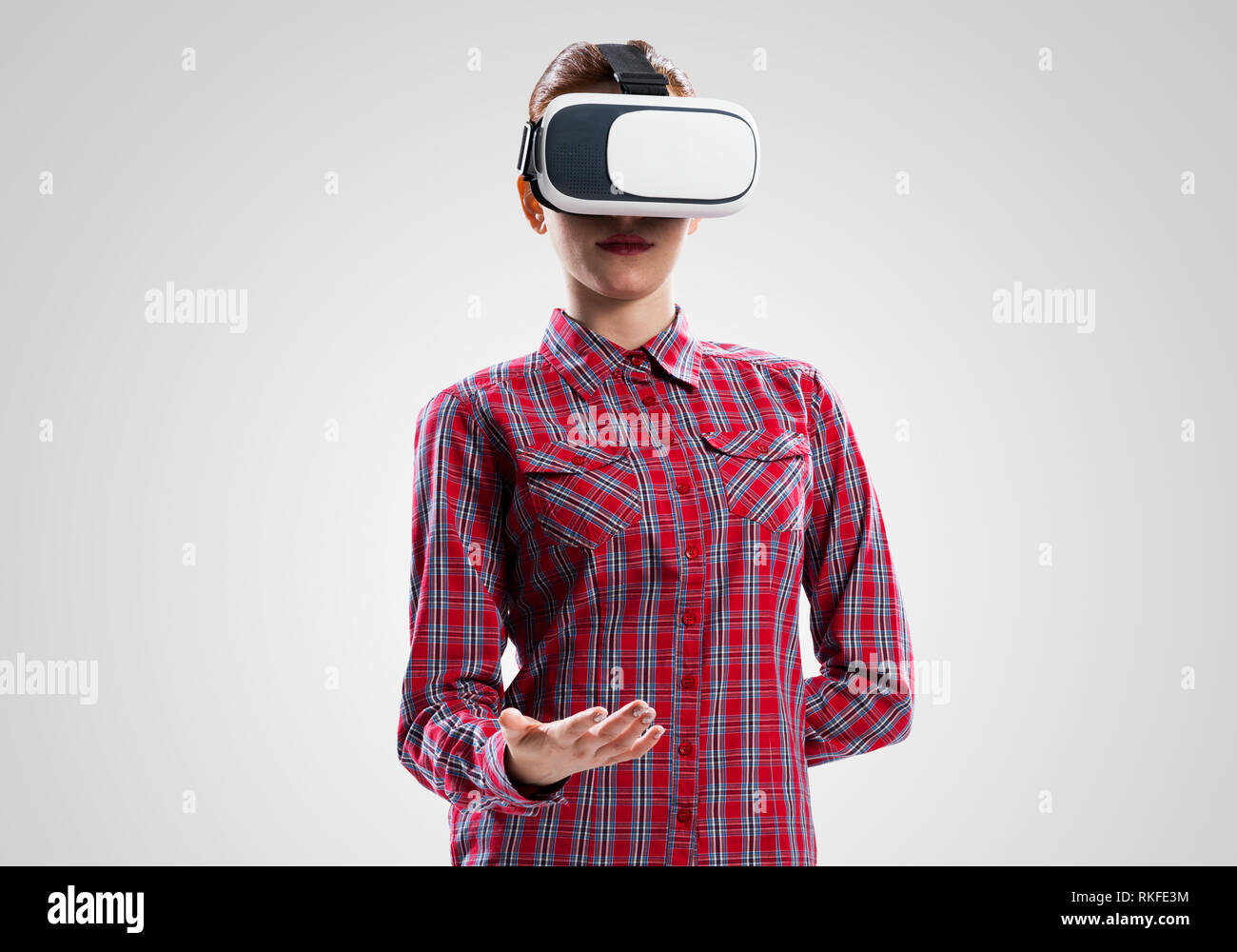 Girl in mask experiencing virtual reality as new entertainment device ...