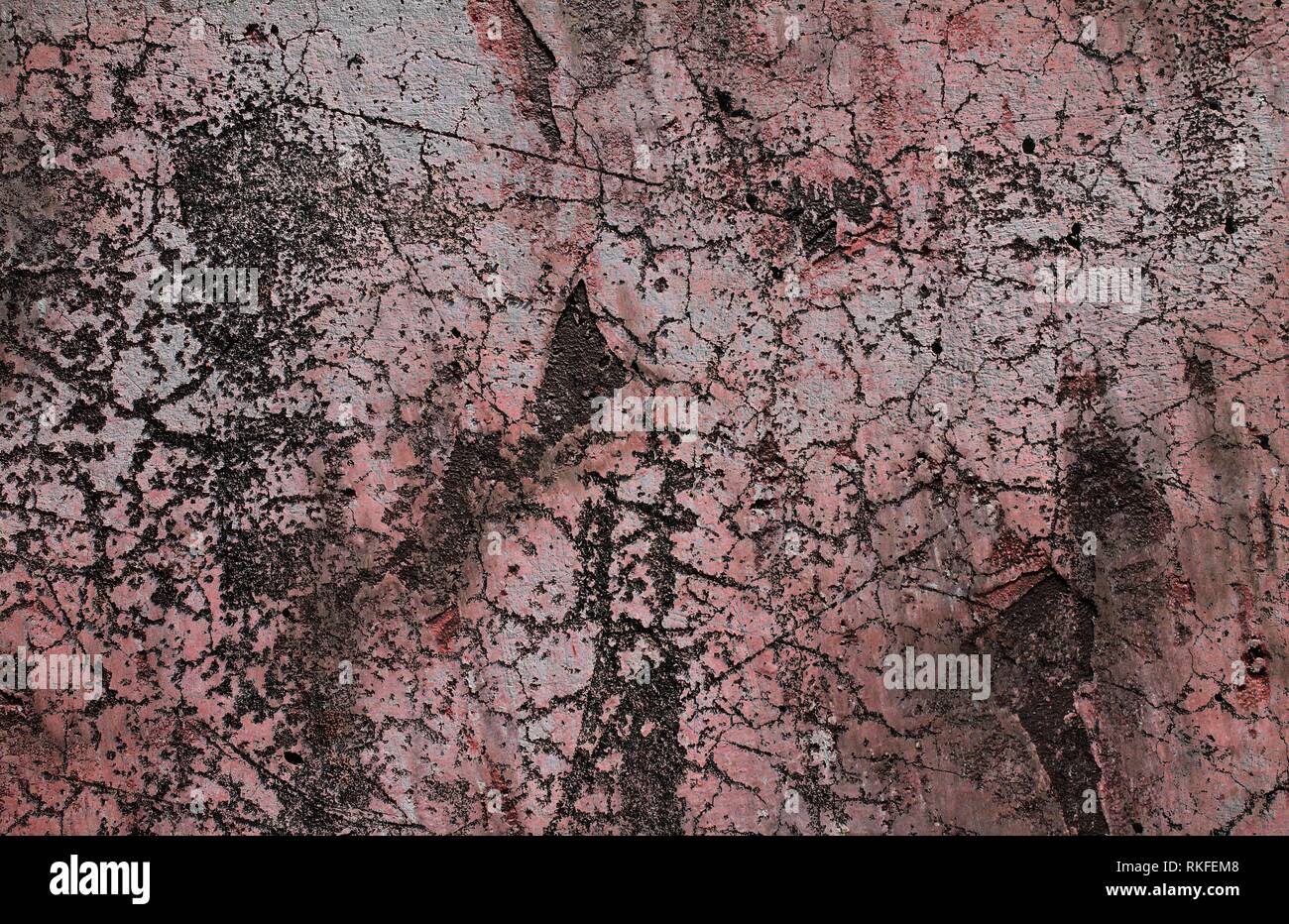 Close up of cracks in aged weathered cement and concrete walls of ...