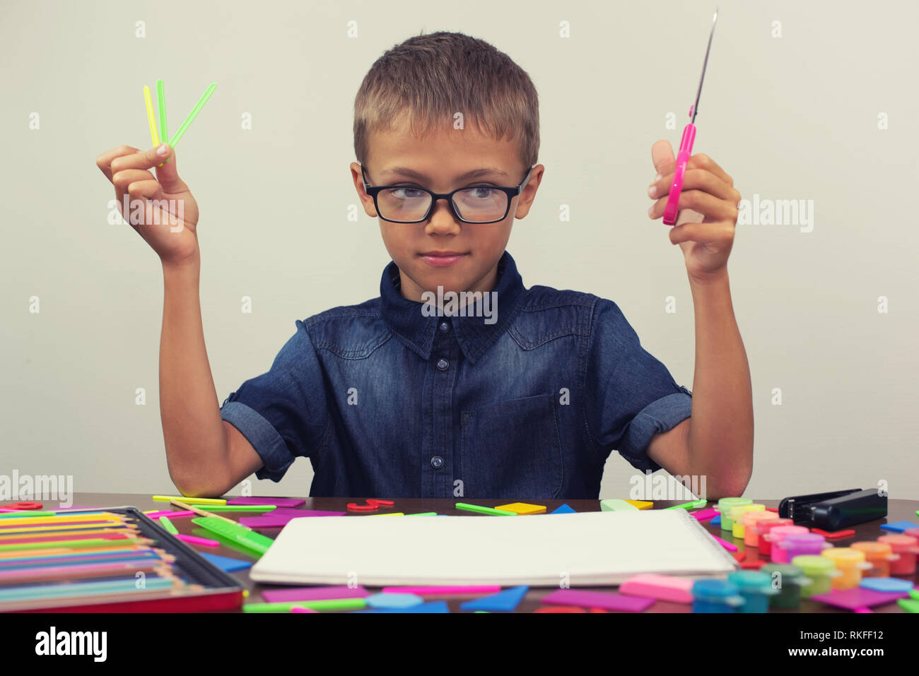 The boy is engaged in creativity at the table draws. Creative classes ...