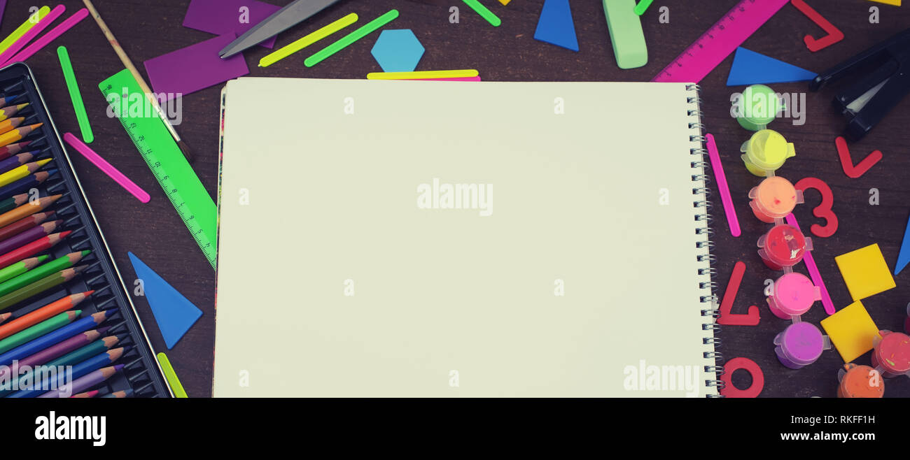 Banner A set of stationery for school notebook lying on the table. Top ...