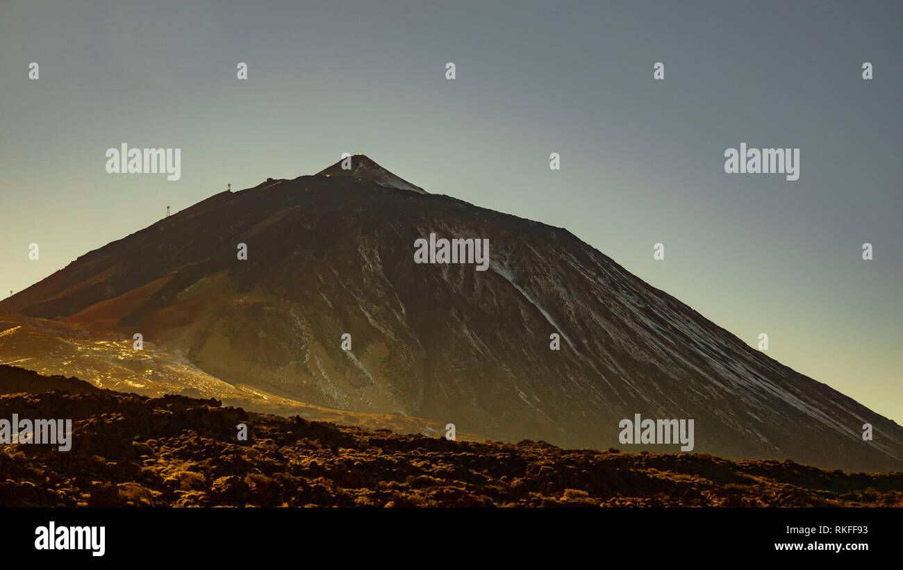 Orange sunset with Teide volcano in Tenerife Stock Photo - Alamy