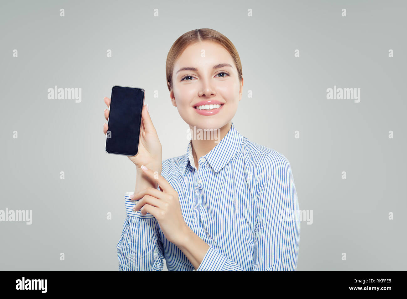 Girl showing cell phone with empty copy space. Happy woman with ...