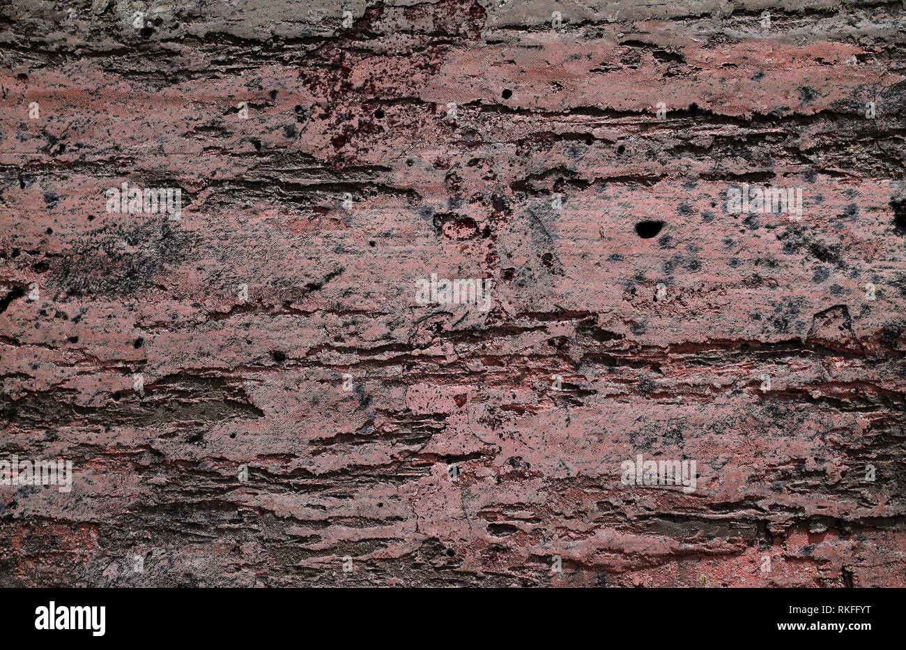 Close up of cracks in aged weathered cement and concrete walls of ...