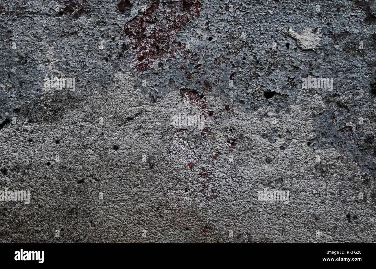 Close up of cracks in aged weathered cement and concrete walls of ...