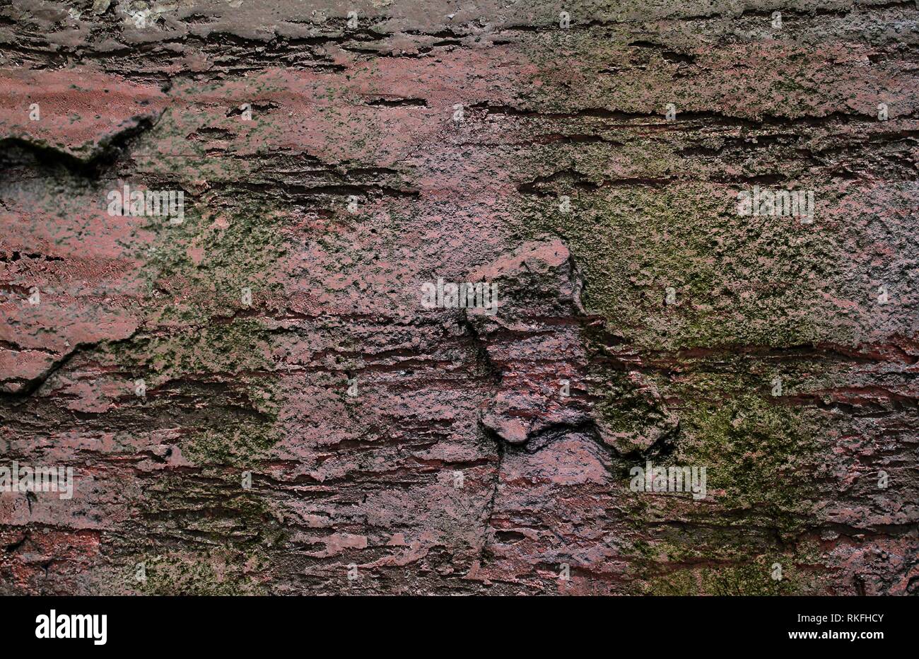 Close up of cracks in aged weathered cement and concrete walls of ...