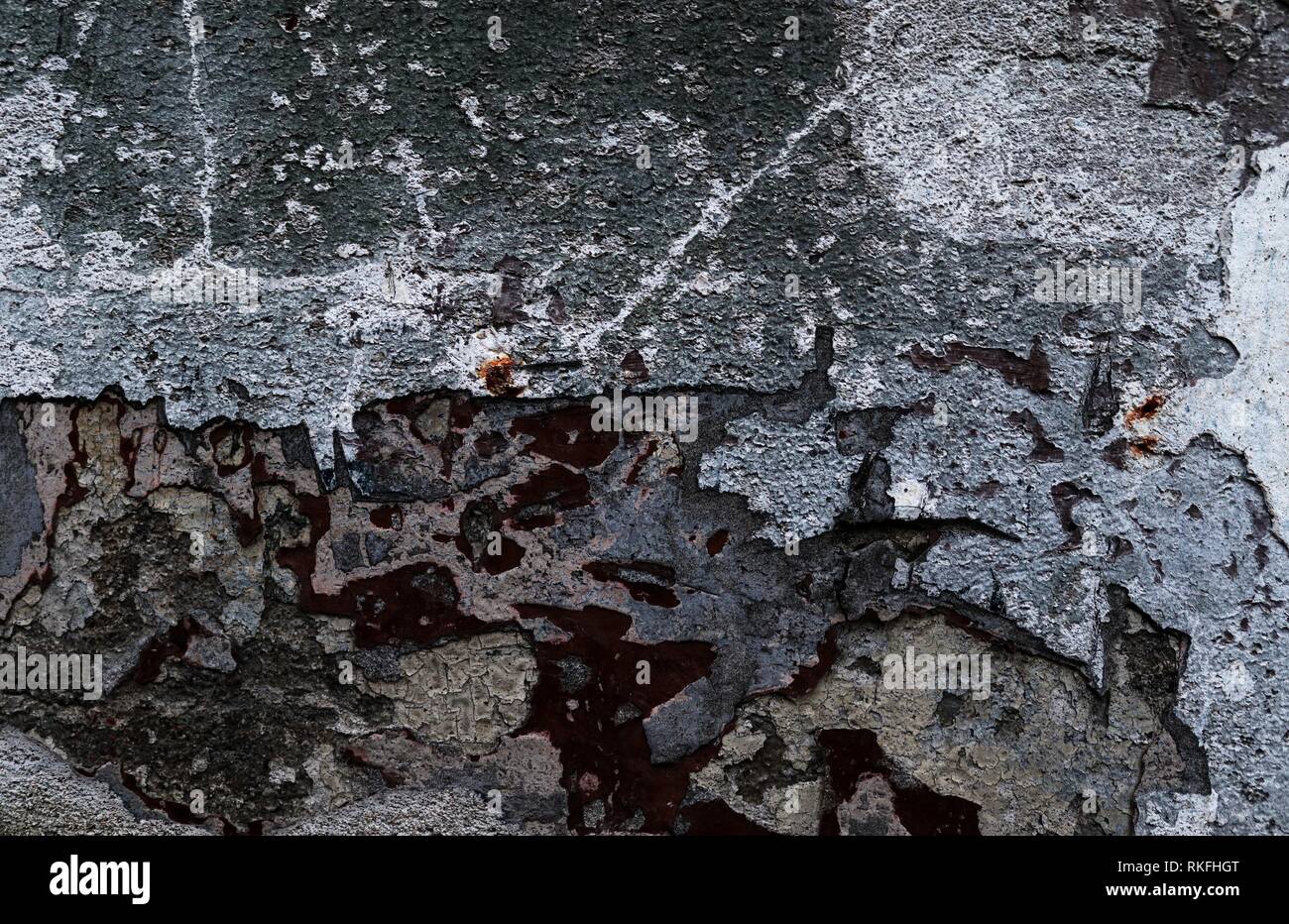 Close up of cracks in aged weathered cement and concrete walls of ...