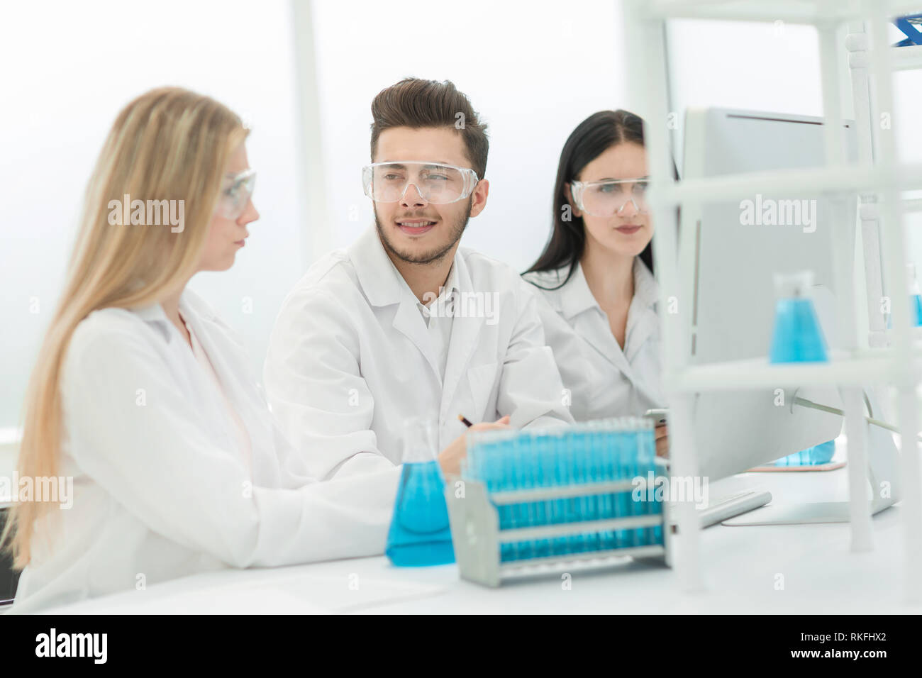 Serious young scientist sitting hi-res stock photography and images - Alamy