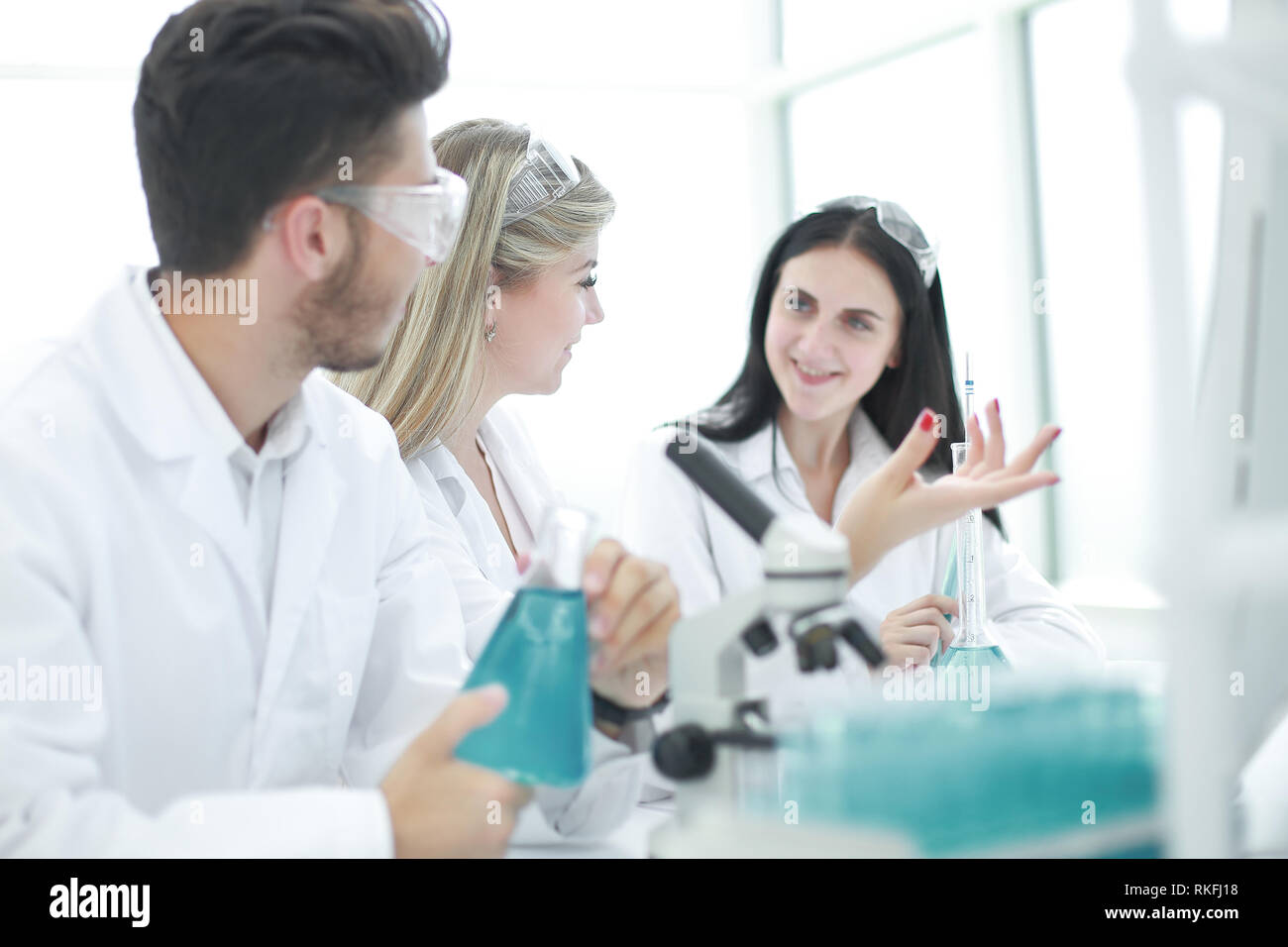 rear view.a group of scientists working in a modern laboratory Stock ...