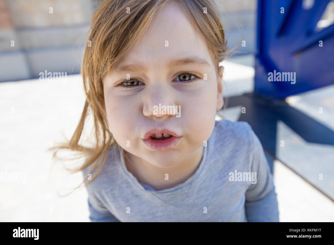 close up portrait of three years old child face, with grey shirt ...