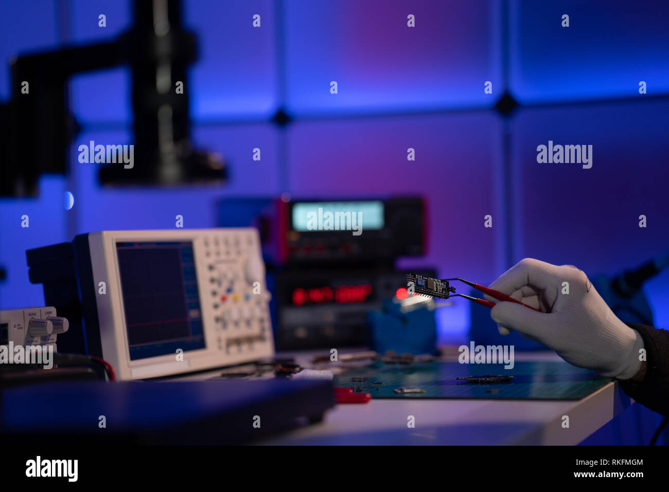 Check electronics device in industrial lab Stock Photo - Alamy