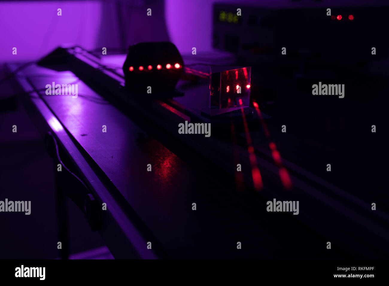 Experiment with red laser in optics lab Stock Photo - Alamy