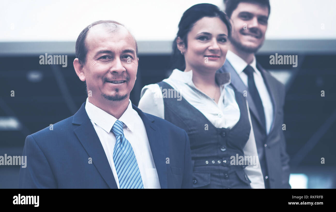 smiling employees standing around in their manager Stock Photo - Alamy