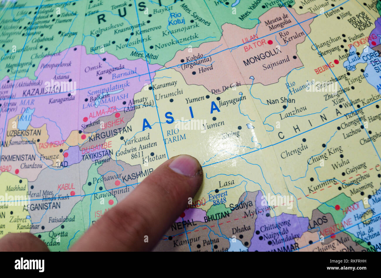 Finger of a man pointing to the next destination on a map, Travel ...