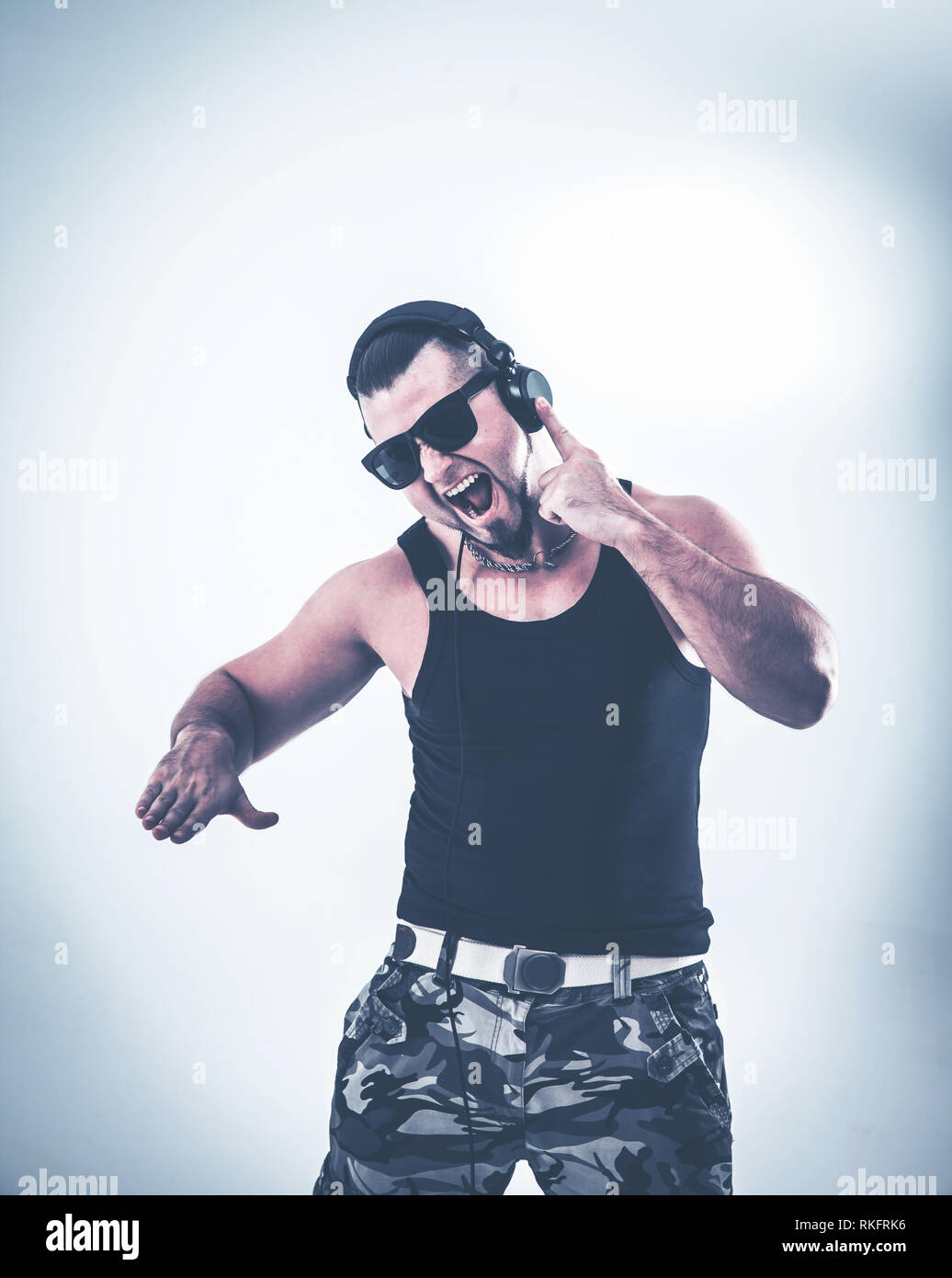 emotional and charismatic DJ - rapper with headphones Stock Photo - Alamy