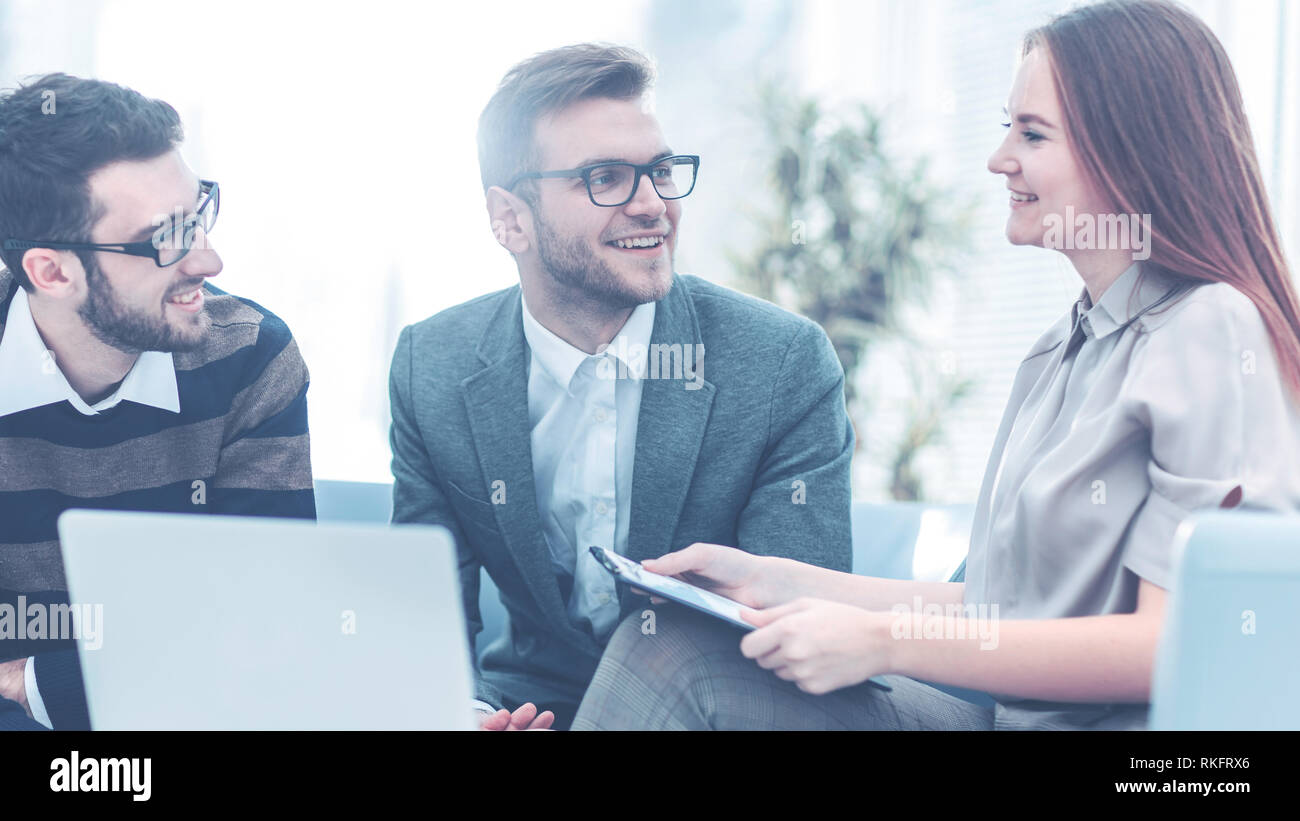 senior Manager and members of the business team discussing a financial ...