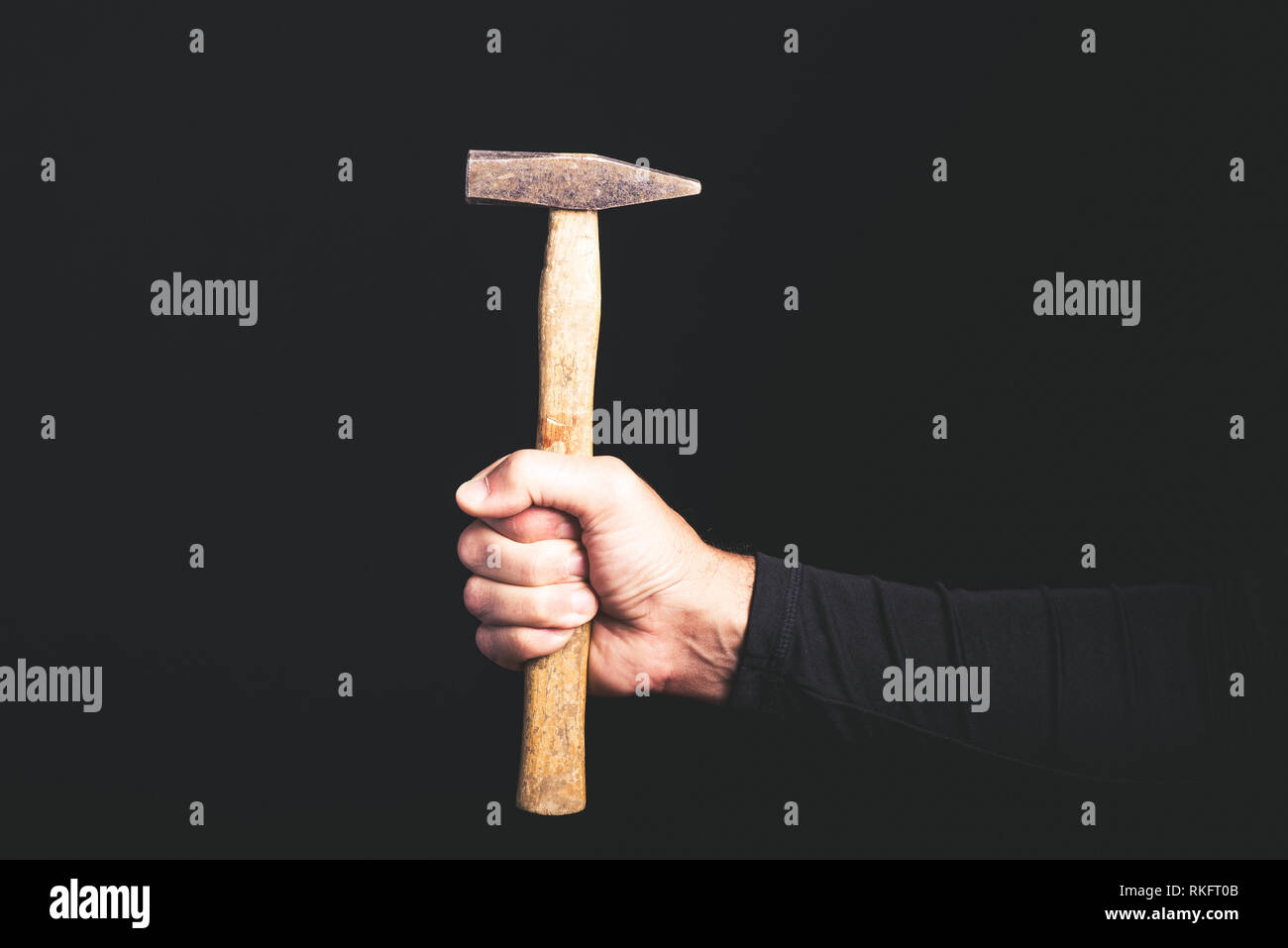 hammer - tools in a man hand - maintenance service concept Stock Photo ...