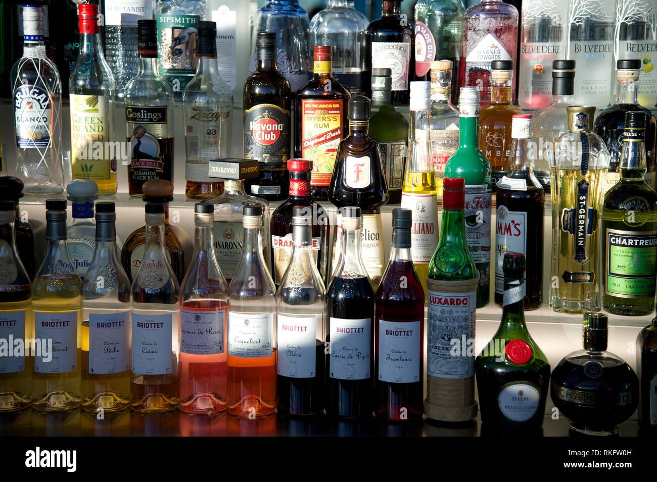 Drinks on display with glasses Stock Photo - Alamy