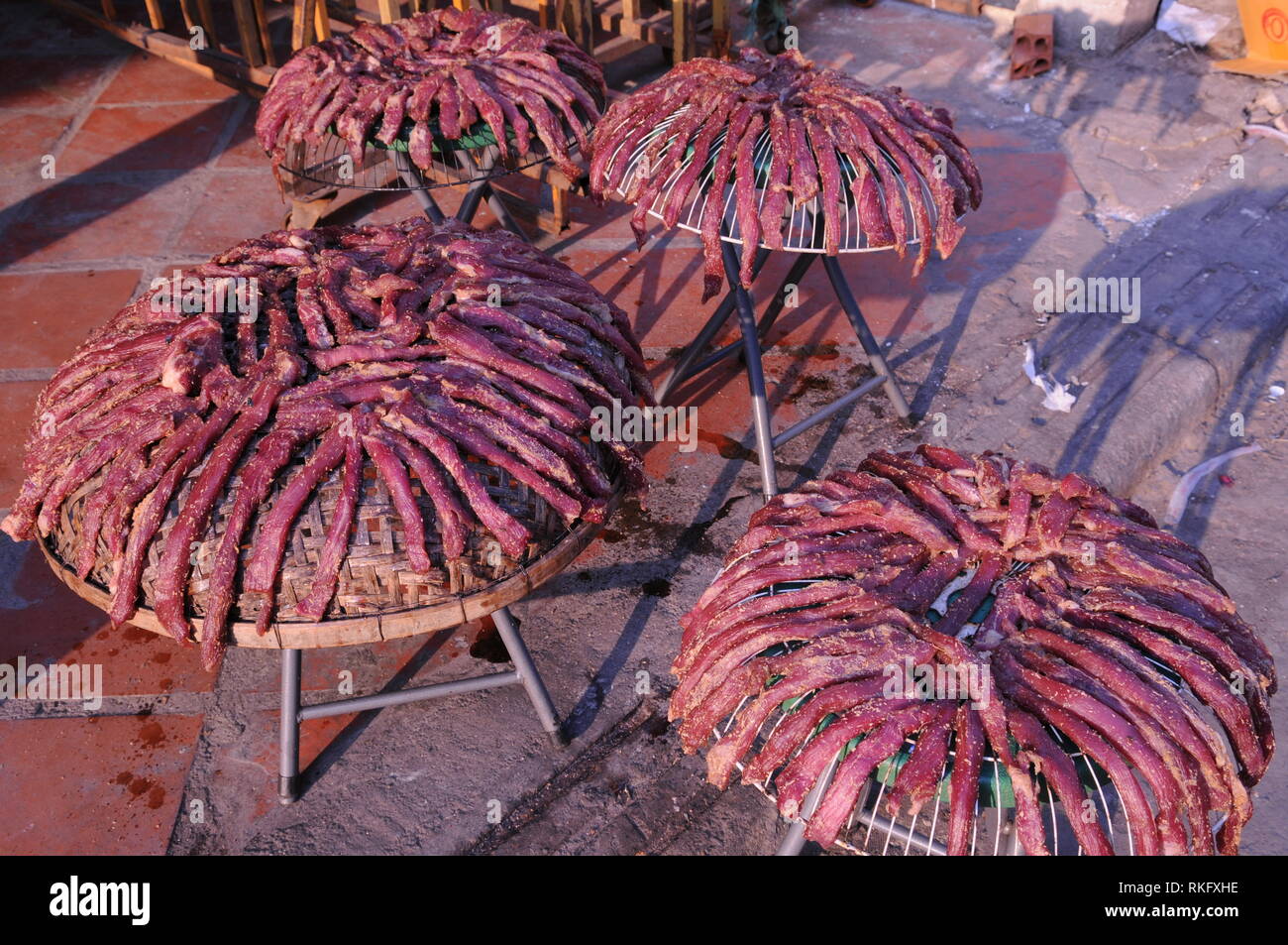 Beef drying in the sun on a rattan basket, Steung Mean Chey, Phnom Penh ...