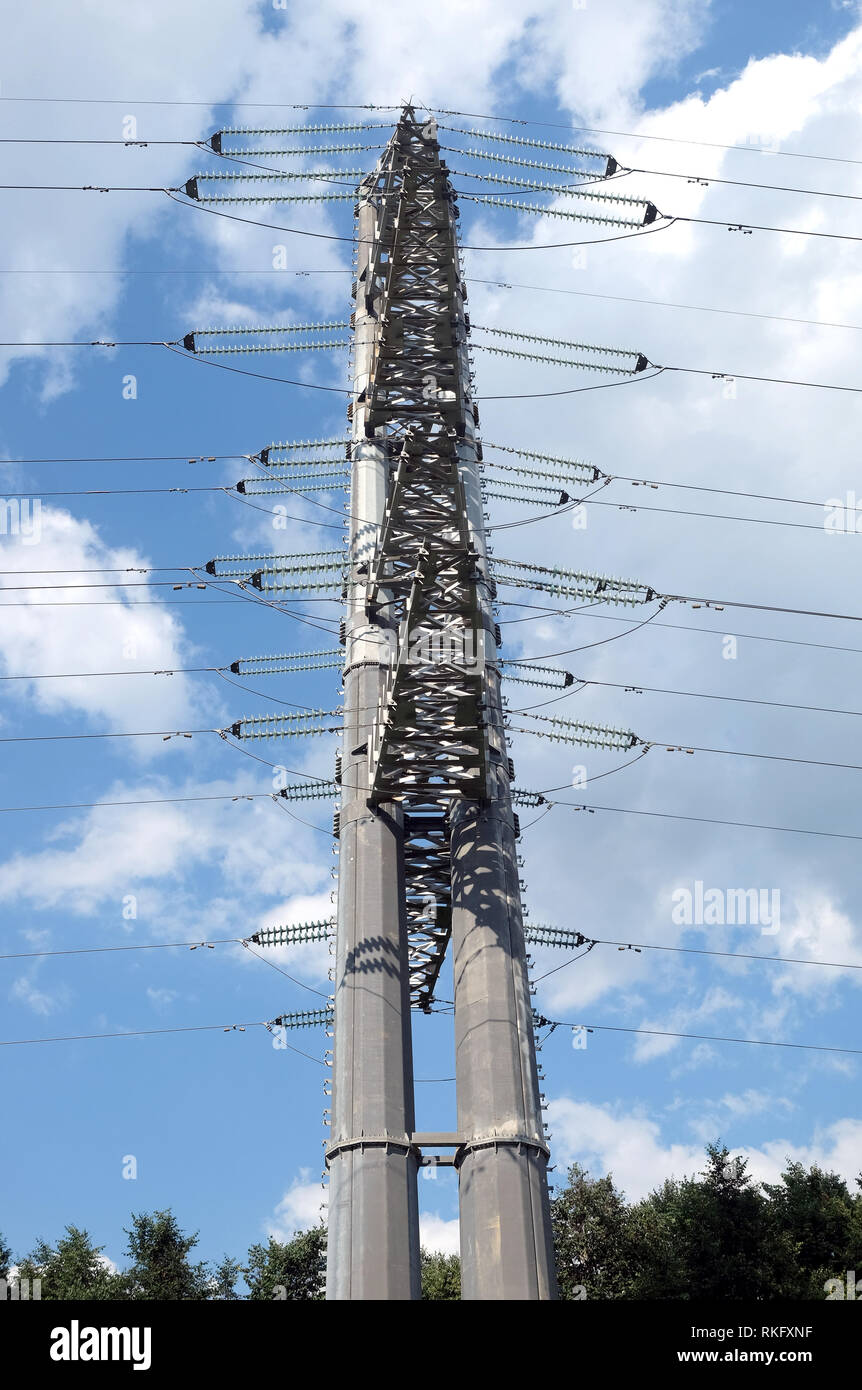 High-voltage power line gray metal prop with many wires side view ...