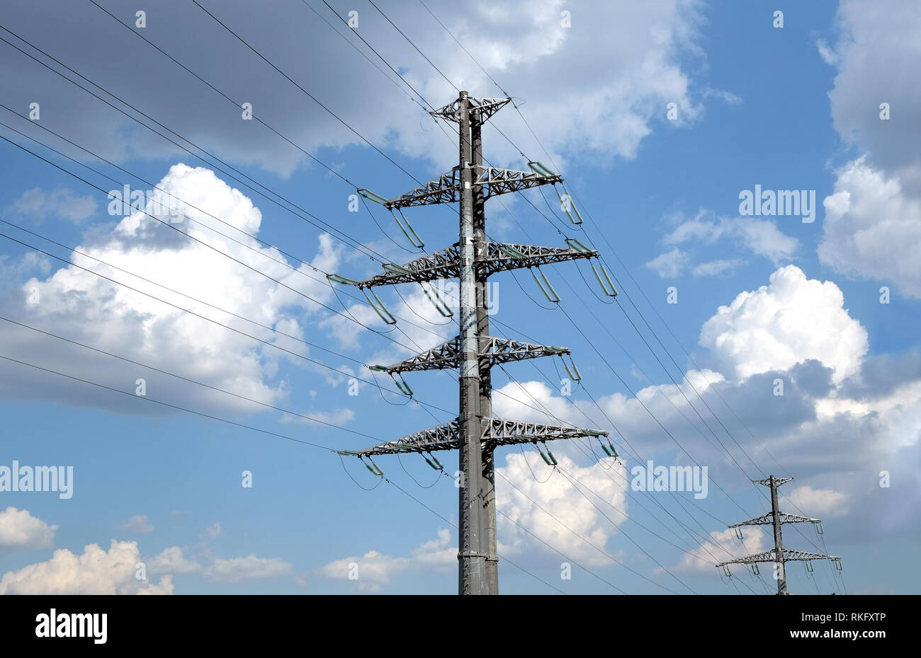 High-voltage power line gray metal props with many wires closeup view ...