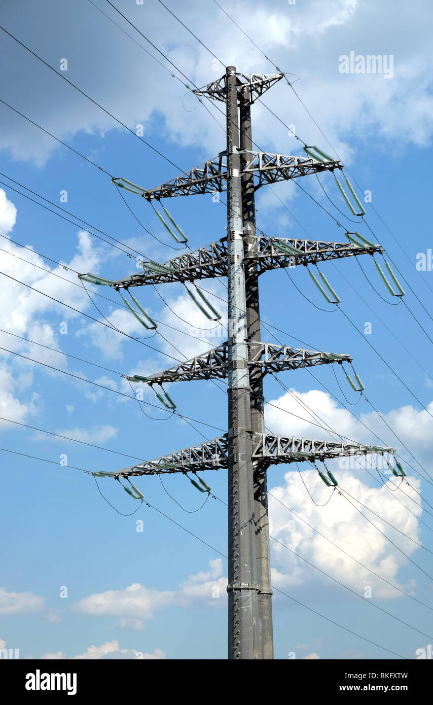 High-voltage power line grey metal prop with many wires vertical view ...