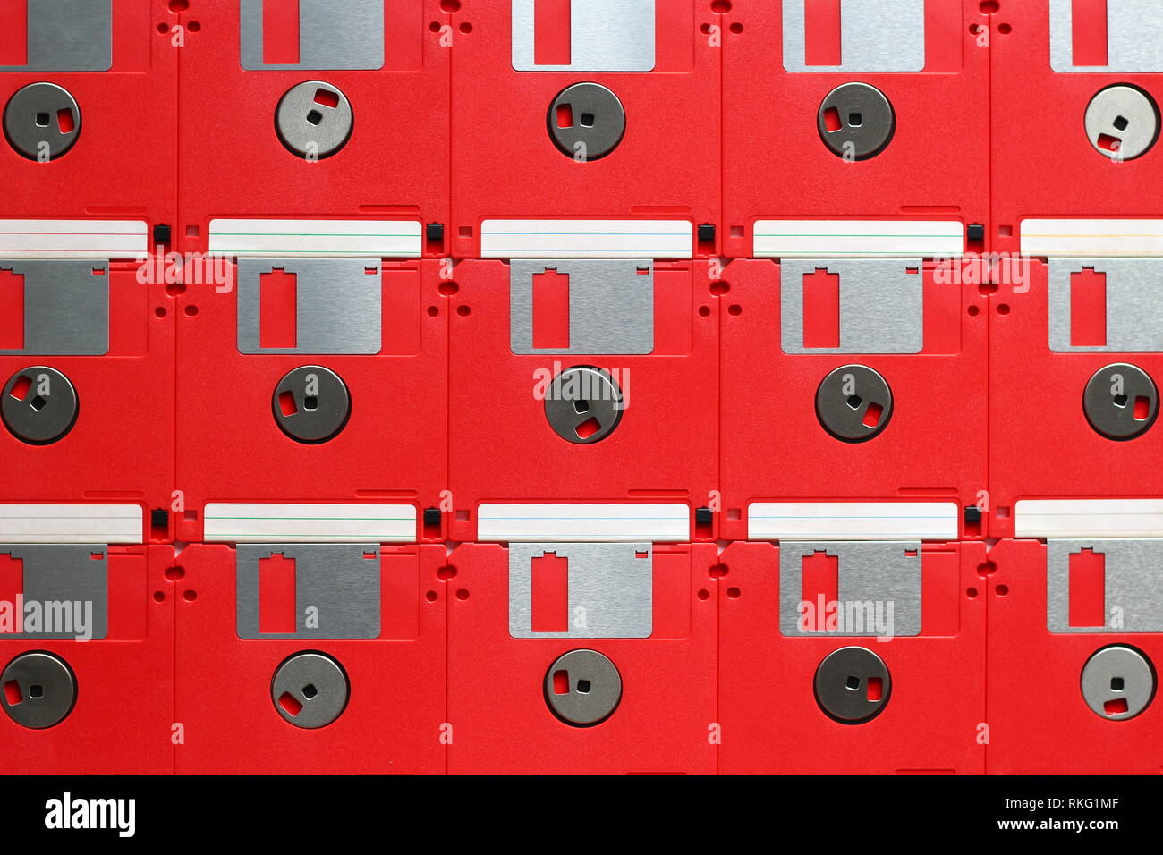 Floppy disks, red diskettes placed next to each other, seen from above ...