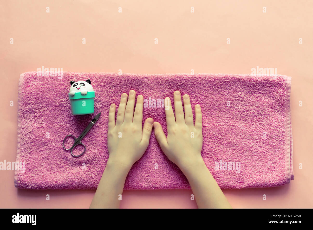 Hand and nail care for the child. Children's manicure. View from above ...