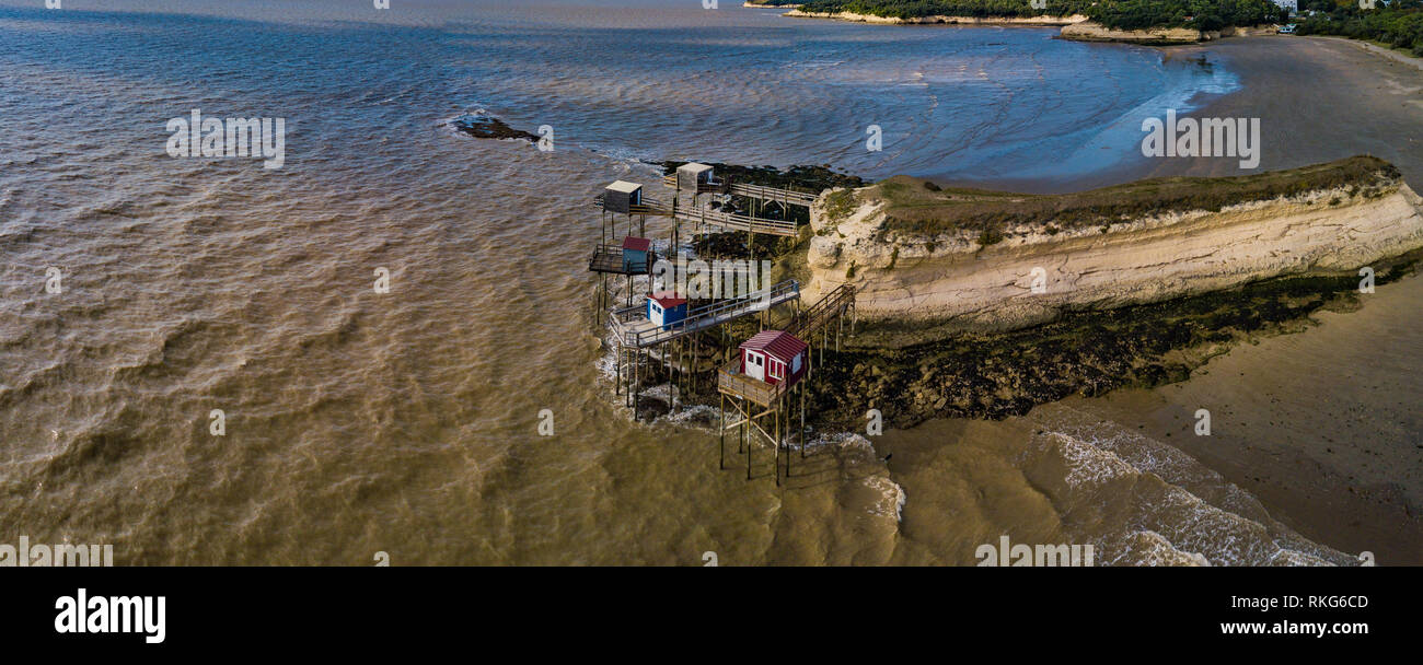 Traditional fisherman wooden hut at the bottom of the limestone cliff ...
