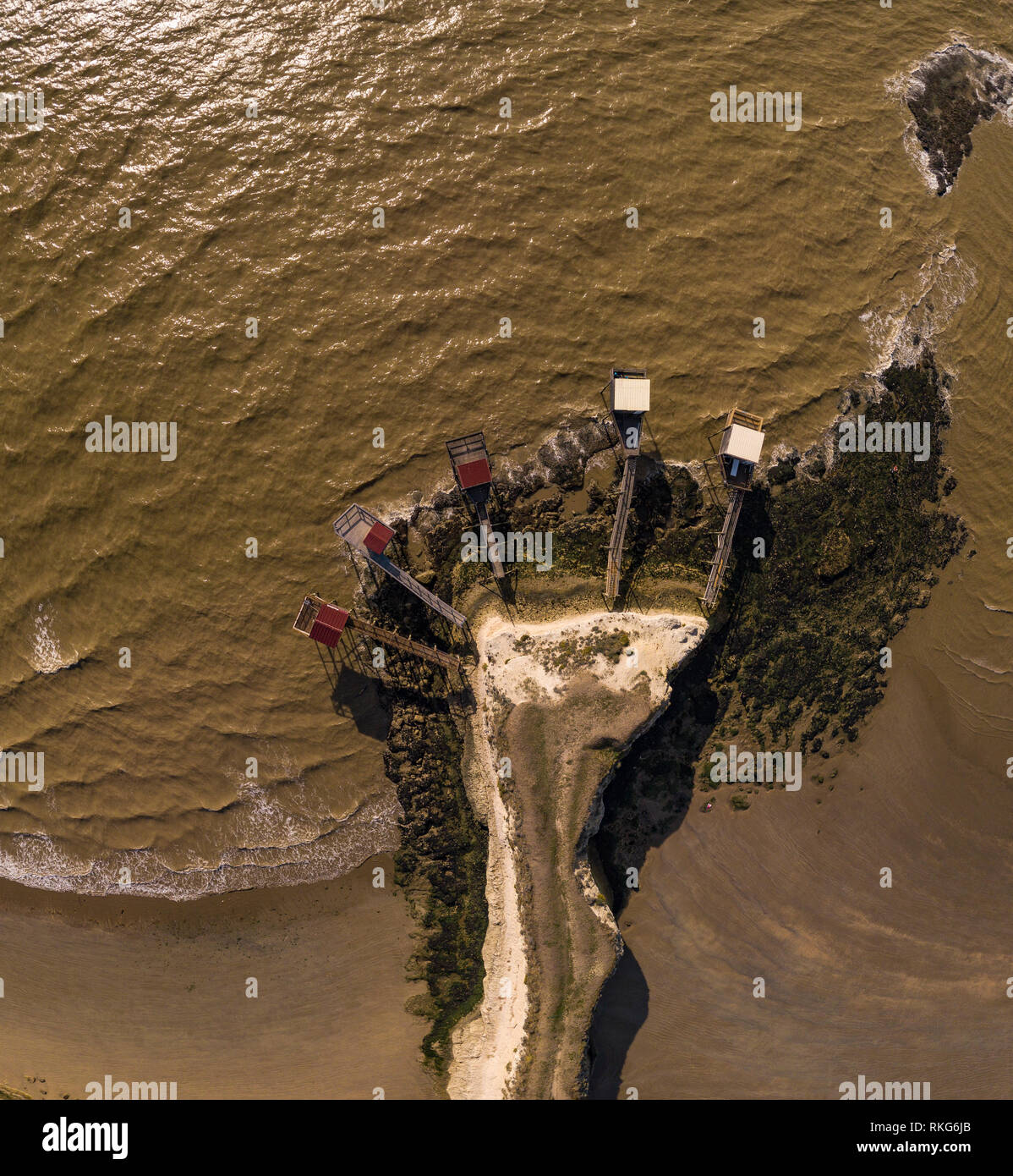 Traditional fisherman wooden hut at the bottom of the limestone cliff ...