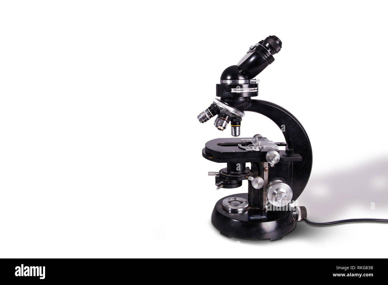 Microscope and white background. Black professional microscope Stock ...