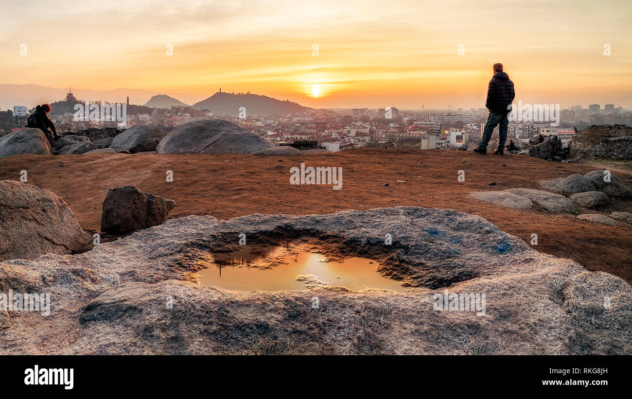 Peoples are watching sunset from ancient fortress build on Nebet tepe ...