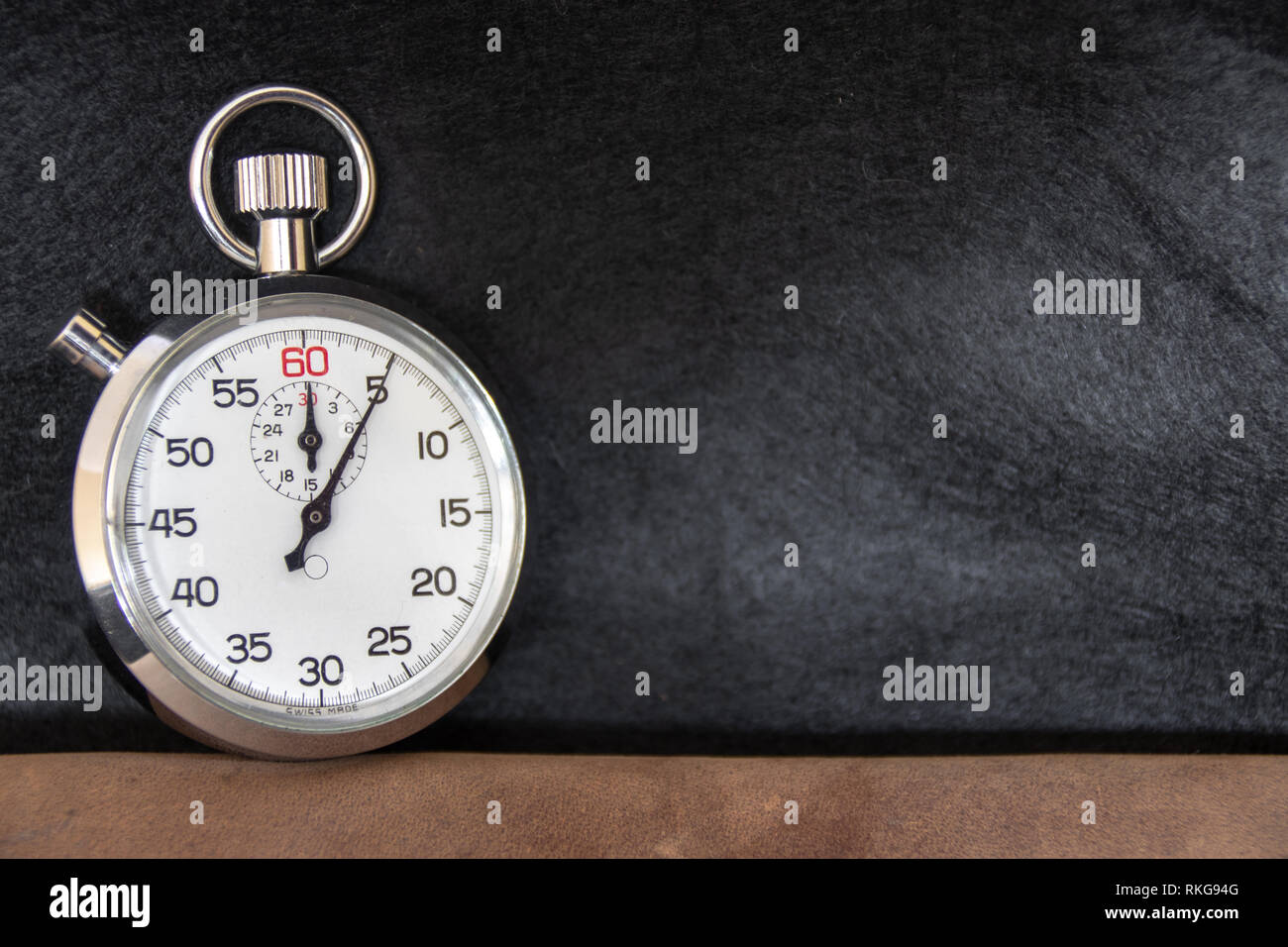 Classic stopwatch on black background Stock Photo - Alamy