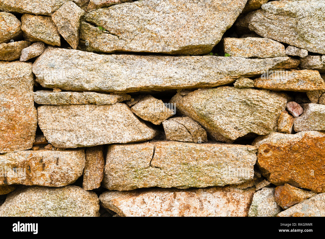 Texture of a granite stone wall Stock Photo - Alamy