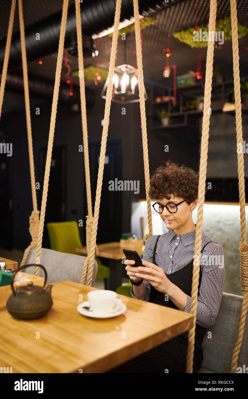 Texting in cafe hi-res stock photography and images - Alamy