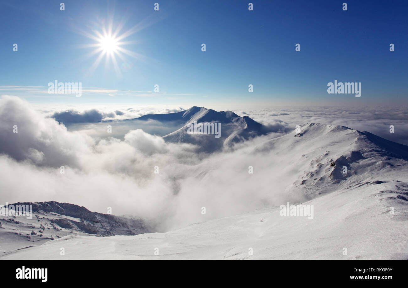 Winter mountain landscape with sun Stock Photo - Alamy