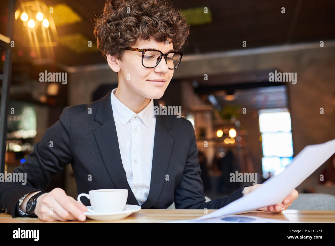 Agent reading contract Stock Photo - Alamy