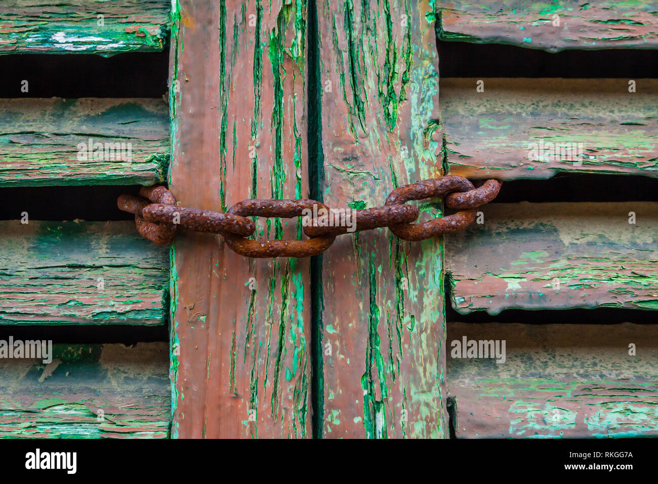 Wooden window shutter with a chain Stock Photo - Alamy