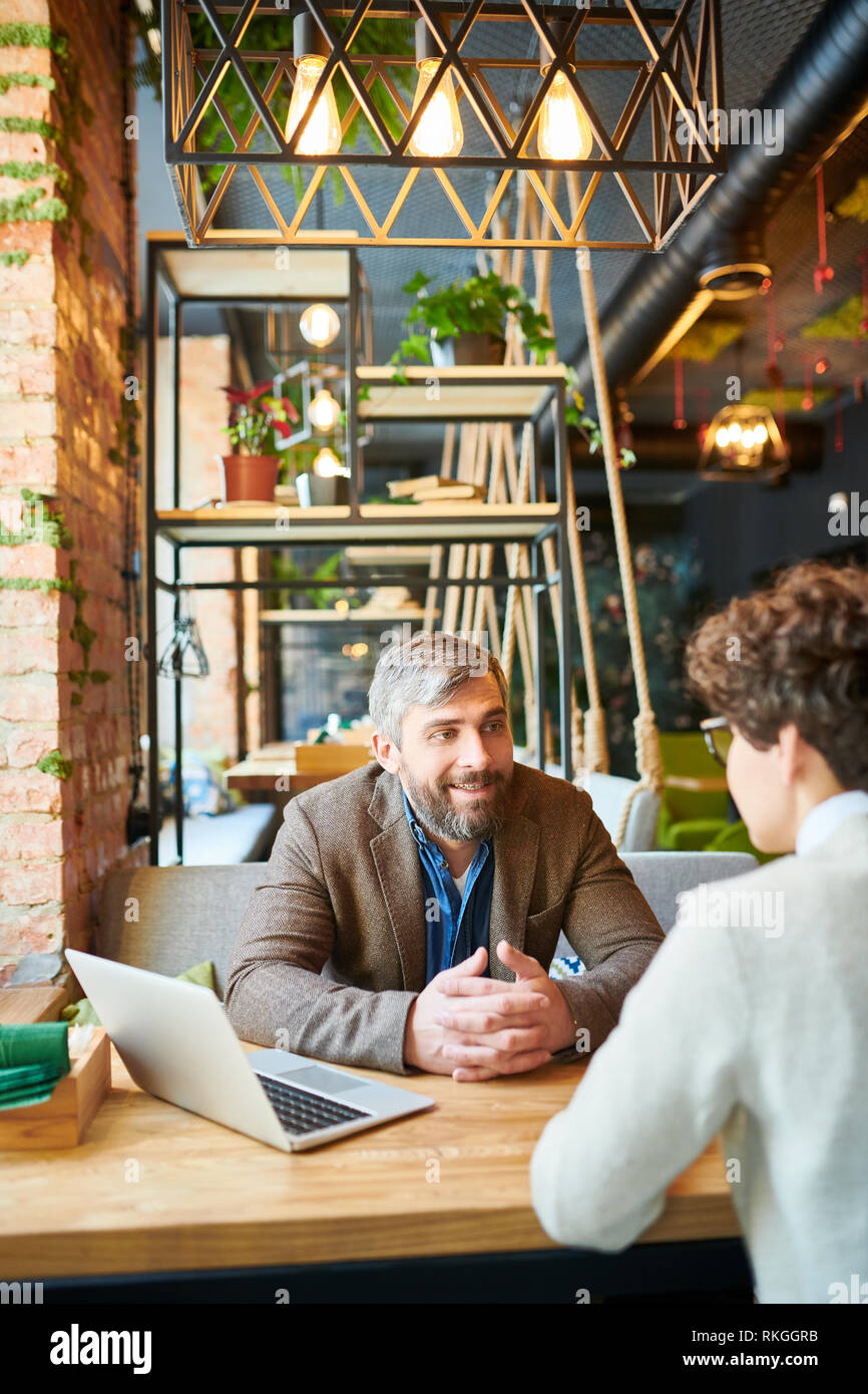 Discussing project at meeting Stock Photo - Alamy