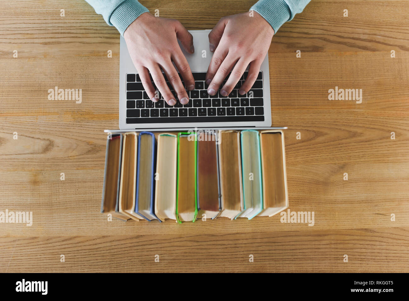 Person studying books laptop hi-res stock photography and images - Alamy