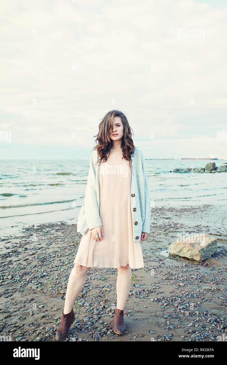 Young woman fashion model in season cloth outdoors portrait Stock Photo ...