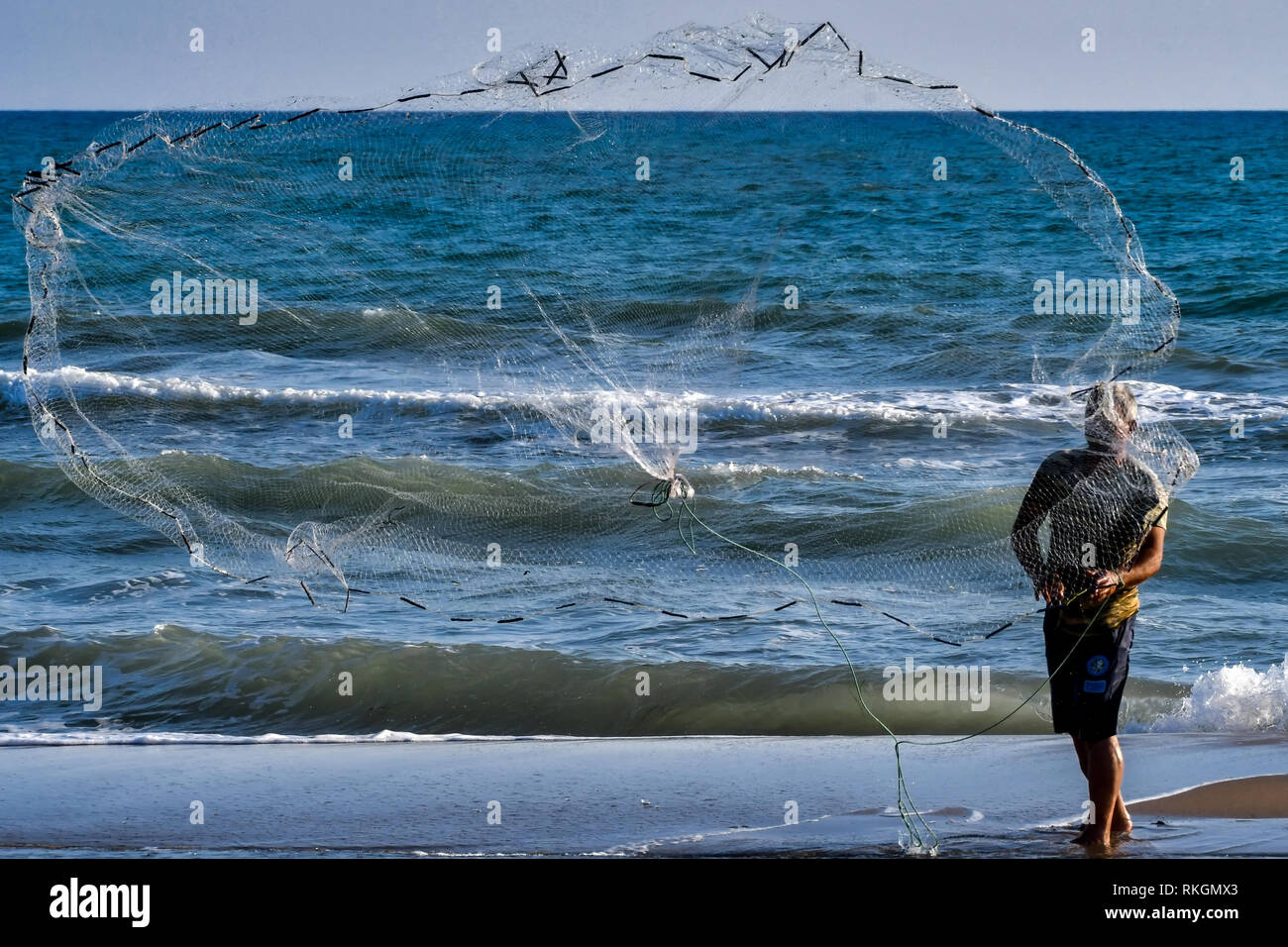 Alpheios, Greece - August 17, 2018: Fisherman casting net during ...