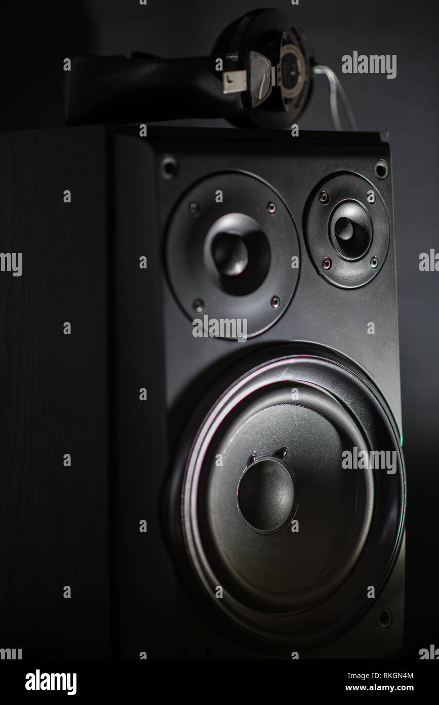 Audio speaker and headphones on top Stock Photo - Alamy