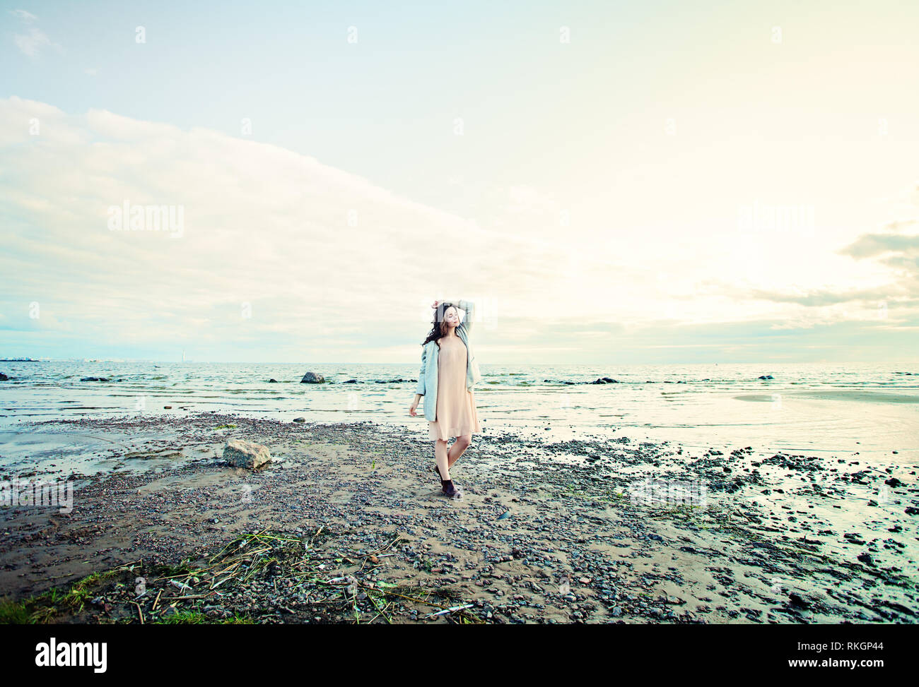 Young woman alone seaside walking hi-res stock photography and images ...