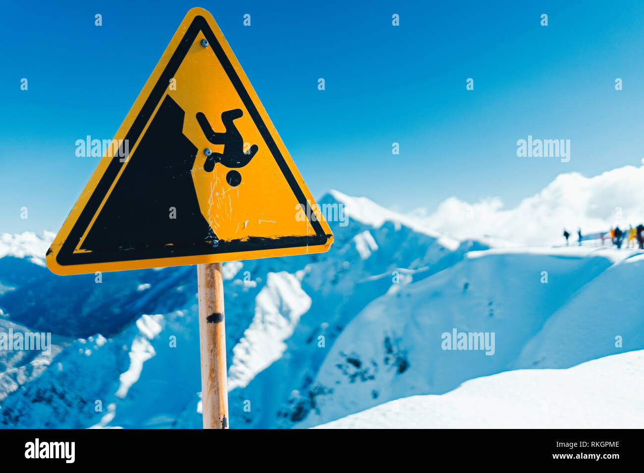 Yellow warning sign in snow covered landscape hi-res stock photography ...