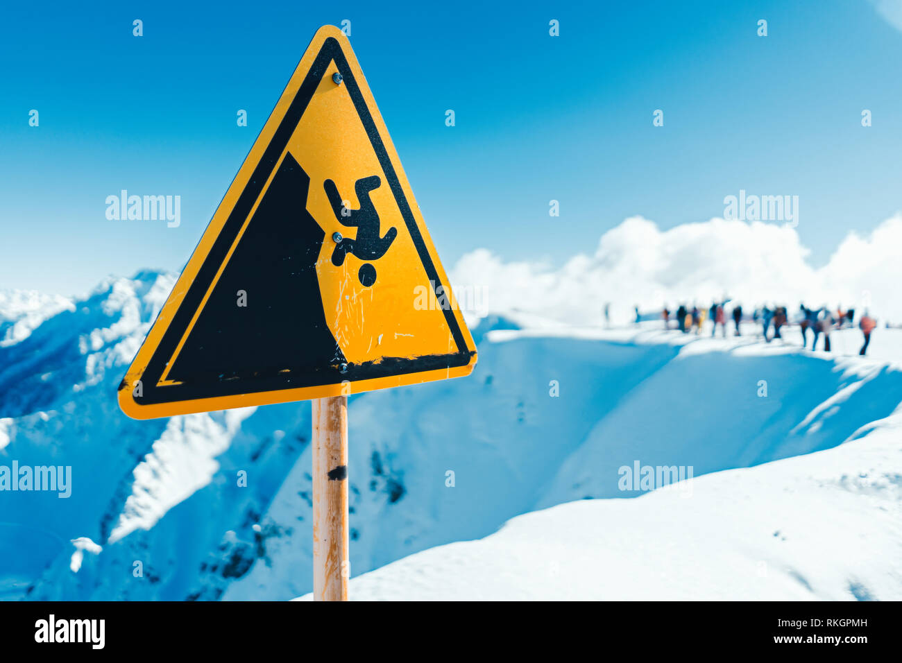 Yellow warning sign in snow covered landscape hi-res stock photography ...