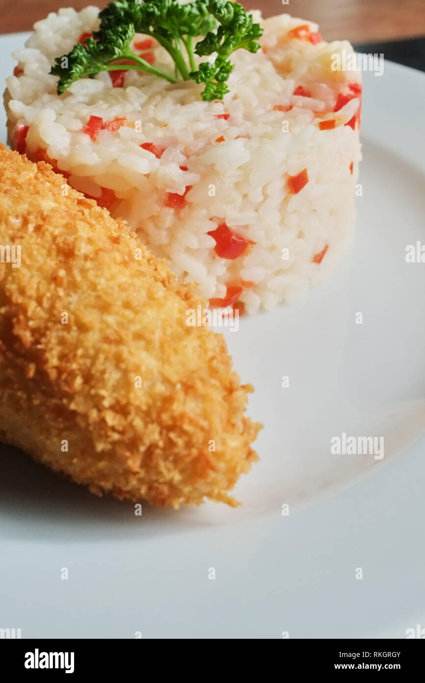 Fried chop with served with steamed rice - top view bright lighting ...