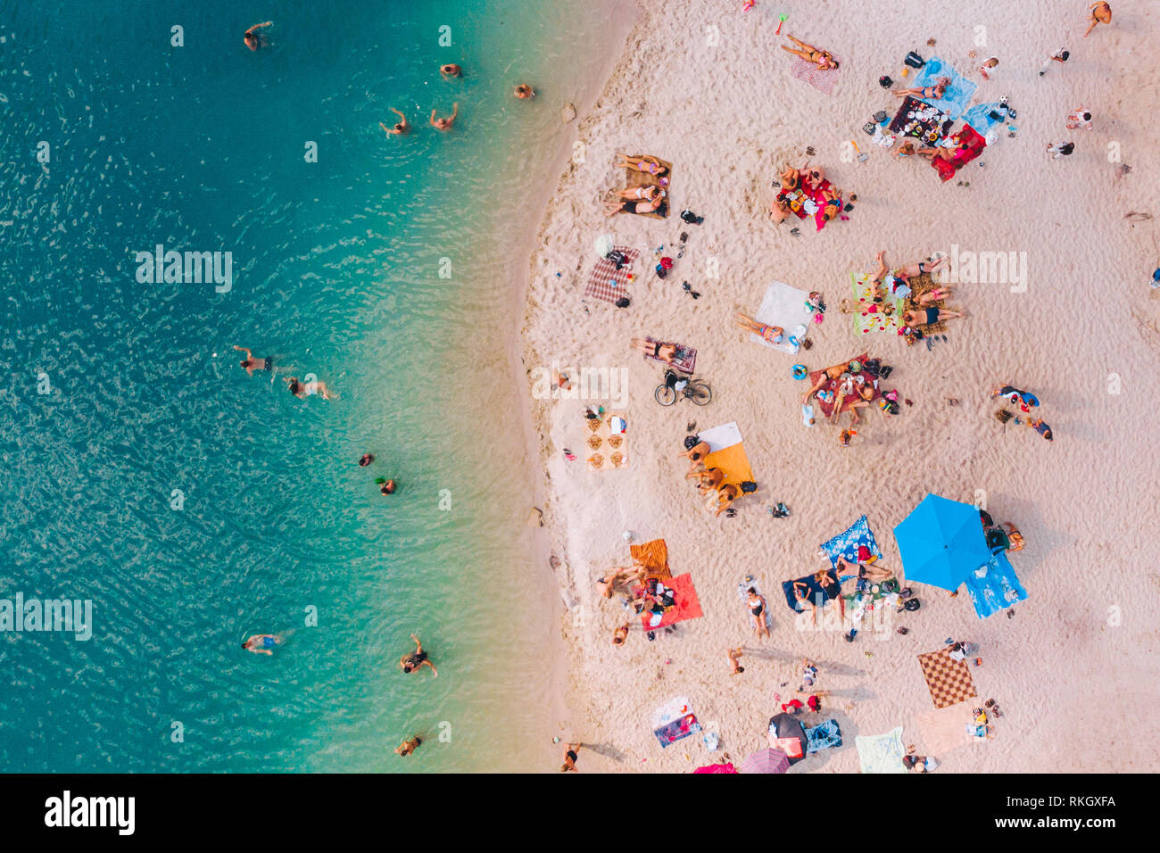 aerial view of sunny sandy beach with blue azure water Stock Photo - Alamy