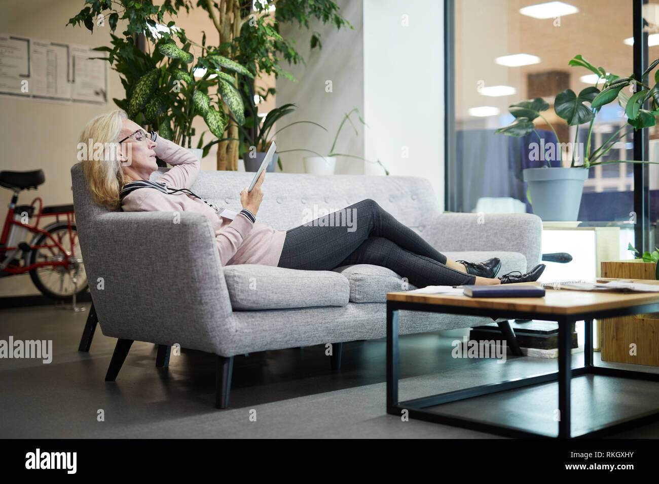 Mature lady searching for information on Internet Stock Photo - Alamy